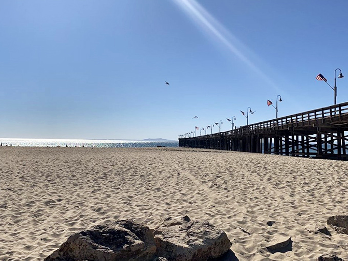 The Ventura Pier stretches toward infinity, a wooden runway leading hungry pilgrims to their seafood salvation.