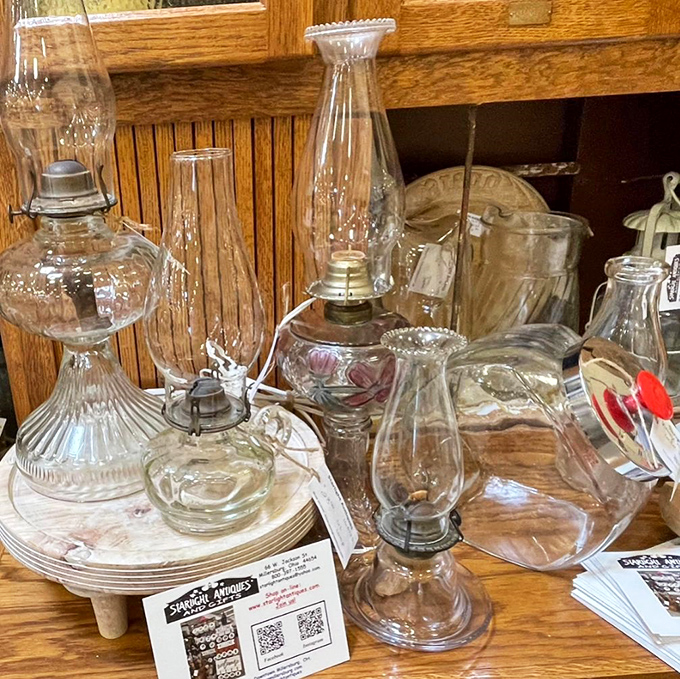 Oil lamps that once illuminated family reading circles now wait for their second act. Clear glass that's survived decades still catches light like it was made yesterday.