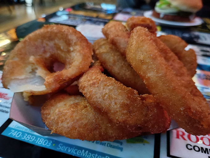 Golden, crispy onion rings that shatter with each bite &ndash; the perfect sidekick to any sandwich on the menu.