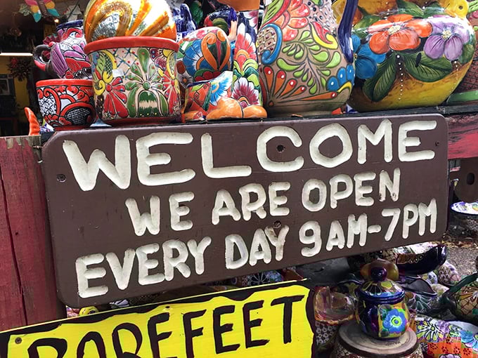 "Open every day" proclaims the handmade sign, because apparently even concrete roosters and giraffes need daily visitors.