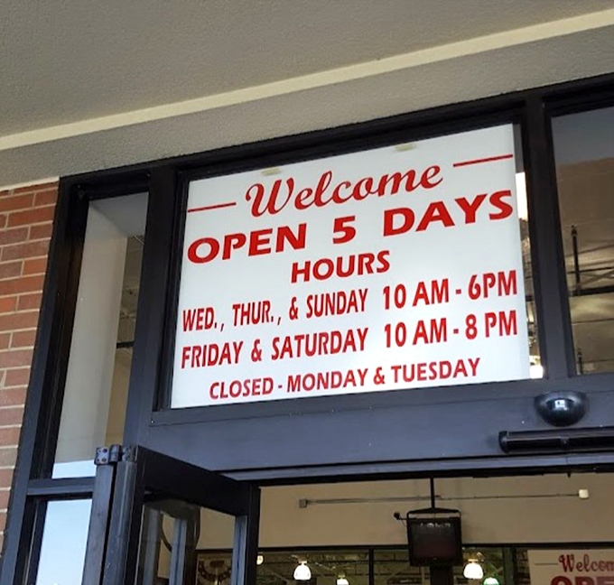 The welcoming hours sign serves as your invitation to this five-day-a-week treasure hunt. Plan accordingly&mdash;discoveries await Wednesday through Sunday!