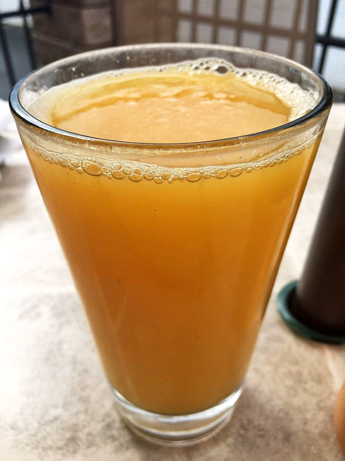 Fresh-squeezed orange juice that tastes like liquid sunshine, reminding you why morning people might be onto something after all.