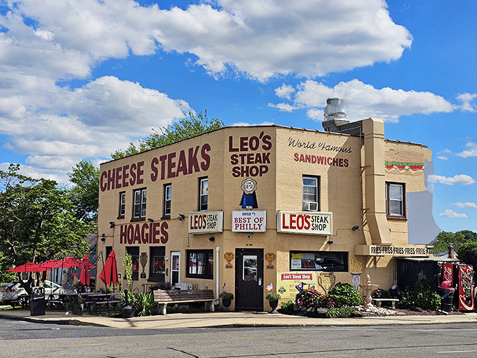Leo's from another angle—a beige building that houses more flavor than most fancy restaurants. Those "World Famous Sandwiches" signs aren't lying.