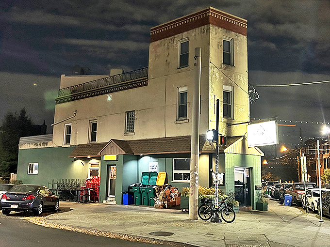 As night falls, Triangle Tavern glows with promise &ndash; a neighborhood lighthouse guiding hungry souls toward comfort food and cold drinks.