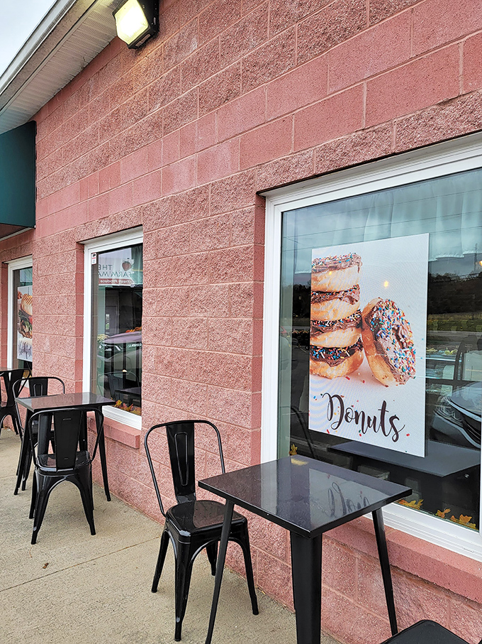 Even the outdoor seating says, "Stay awhile." Black metal chairs against pink brick &ndash; the perfect spot to contemplate how many donuts is too many.