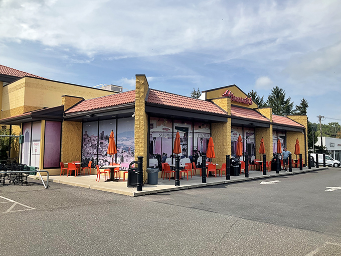 The outdoor seating area&mdash;where Italian market meets Pennsylvania sunshine. Those orange chairs are calling your name for a post-shopping espresso.