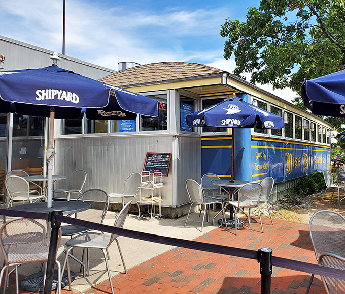 The outdoor seating area, complete with Shipyard umbrellas, offers a perfect Maine summer moment&mdash;ocean breeze optional, excellent food mandatory.