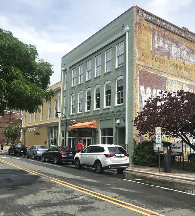 Historic buildings with stories to tell&mdash;Bull City Burger and Brewery's green facade fits perfectly into Durham's architectural tapestry while writing its own delicious chapter.
