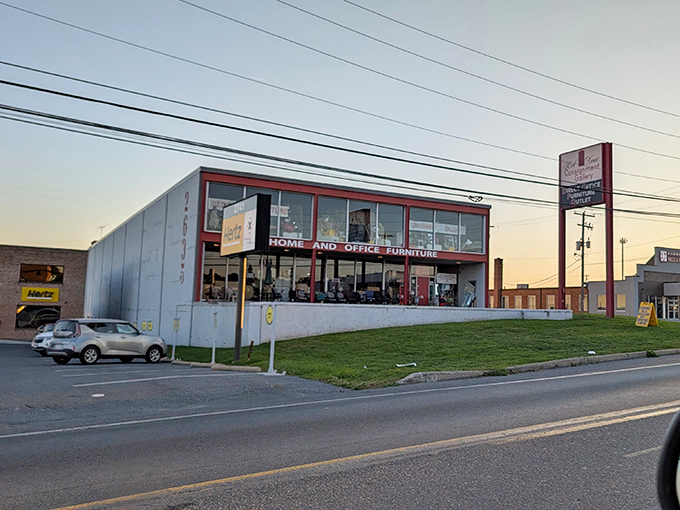 As the sun sets, the Red Door's silhouette stands as a beacon for bargain hunters and home decorators with champagne taste and beer budgets.