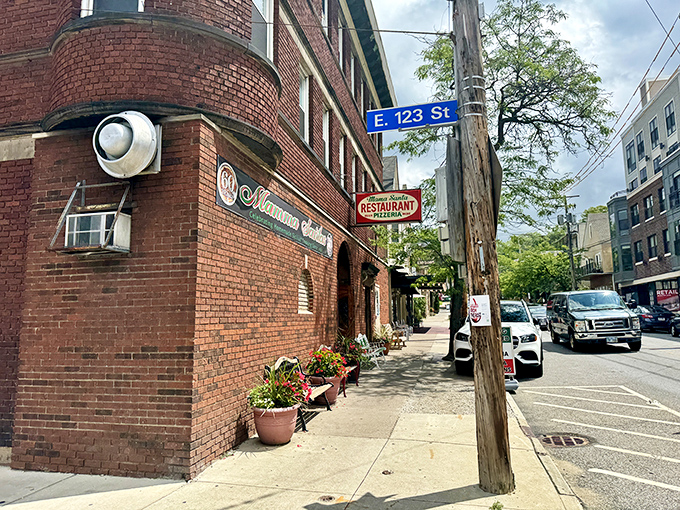 Corner location on E. 123rd Street marks the spot where countless food pilgrimages have begun. The sign promises exactly what awaits inside.