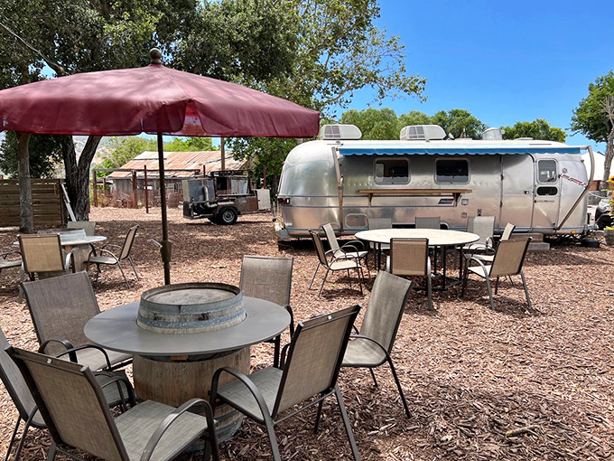The outdoor seating area offers a quintessential California wine country experience – casual, rustic, and somehow both laid-back and special.