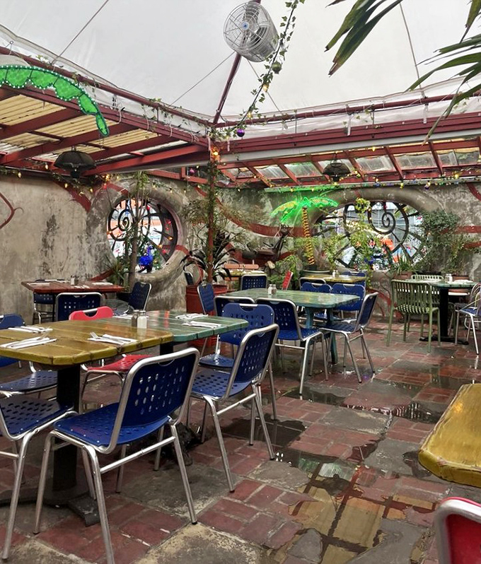 The garden dining area feels like a secret discovery, with whimsical decorations, plants, and skylights creating an urban oasis in the heart of Philadelphia.
