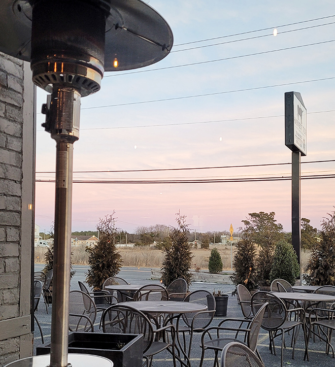 Outdoor dining with heat lamps: civilization's answer to wanting fresh air while still being completely comfortable. Sunset views included.