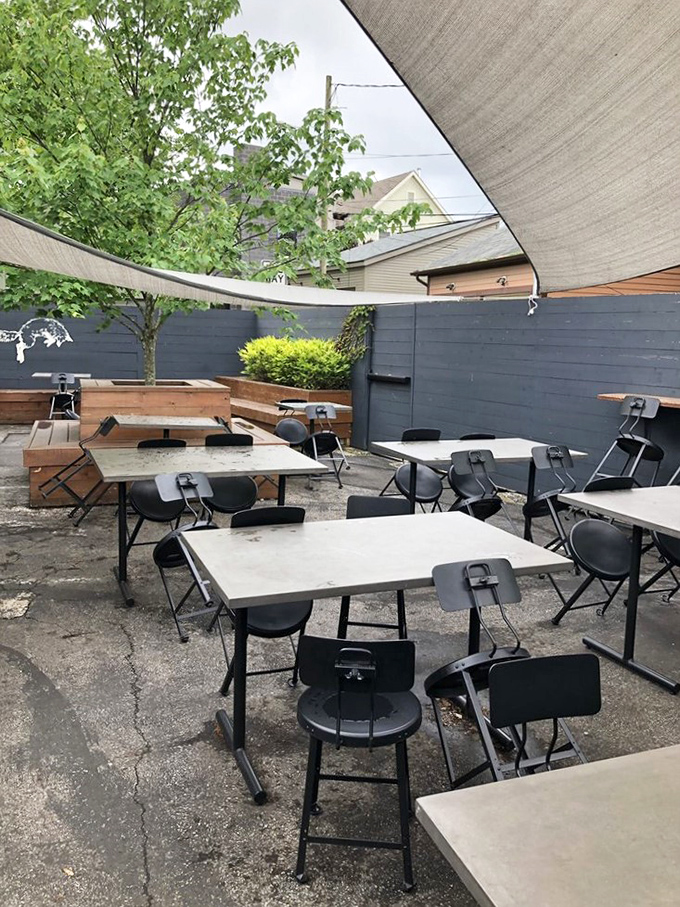 The outdoor seating area offers a peaceful urban oasis. Simple furniture lets the pastries and coffee remain the undisputed stars of the show.