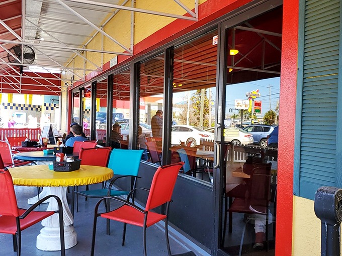 Colorful outdoor seating adds a cheerful touch to Dixie Belle's exterior, perfect for enjoying breakfast while soaking up some Florida sunshine.