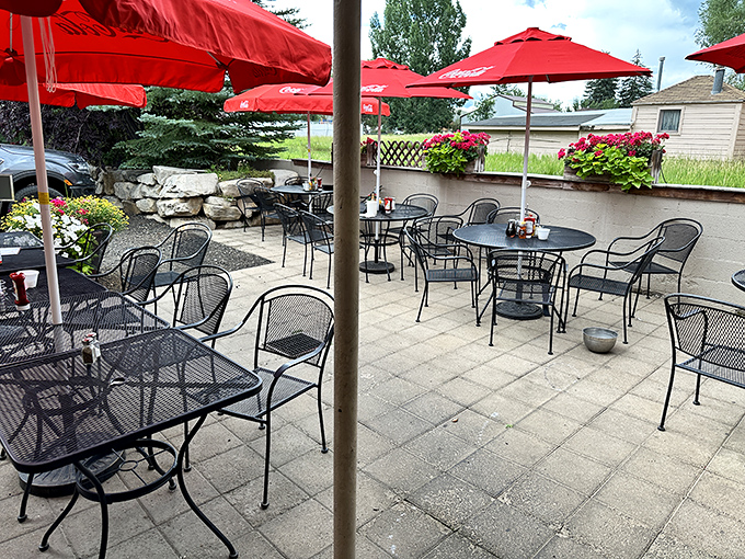 Red umbrellas dot the outdoor patio where summer meals taste even better with a side of fresh mountain air.