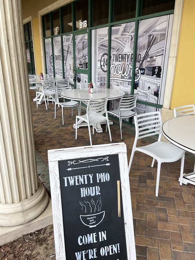 Outdoor seating for those who prefer reality with their meal. The chalkboard sign's steaming bowl illustration practically whispers, "Come get some comfort."
