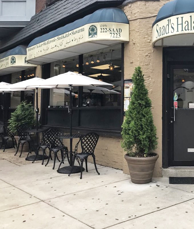 The sidewalk seating area offers a perfect perch for people-watching while your taste buds embark on their own Middle Eastern adventure.