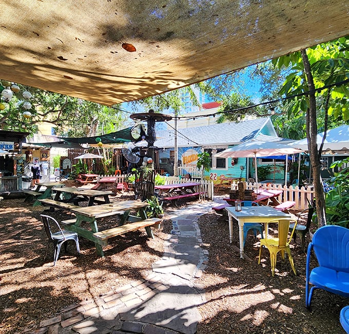 The backyard dining area dappled with Florida sunshine feels like the best picnic you never had to plan. Paradise found.