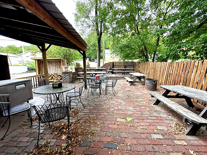 The outdoor patio where barbecue dreams come to life under open skies. Those picnic tables have heard more "mmms" and "wows" than a Hollywood red carpet.