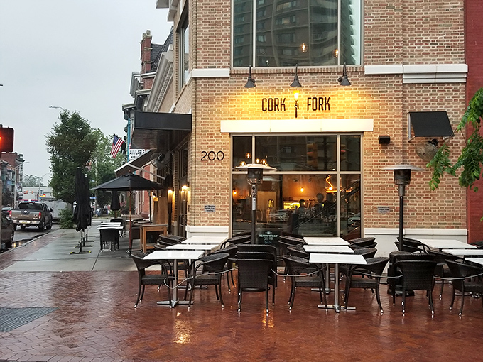 Even on rainy days, Cork & Fork's outdoor seating area maintains its charm, the wet bricks glistening like they're setting the stage for a romantic movie scene.