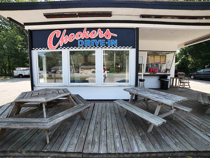 Weathered picnic tables on a wooden deck&mdash;nature's dining room where conversations flow as freely as the ketchup.