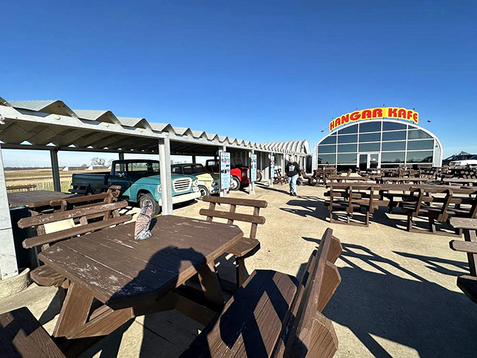 Outdoor picnic tables invite lingering on beautiful days. The vintage truck parked nearby completes the picture-perfect rural Missouri dining experience.