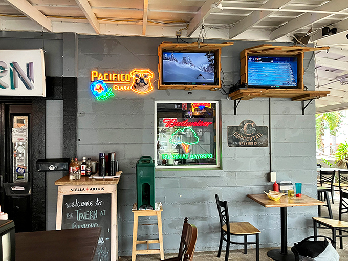 The covered patio where indoor comfort meets outdoor vibes. Those ceiling fans aren't just moving air; they're wafting the scent of grouper sandwiches into your dreams.