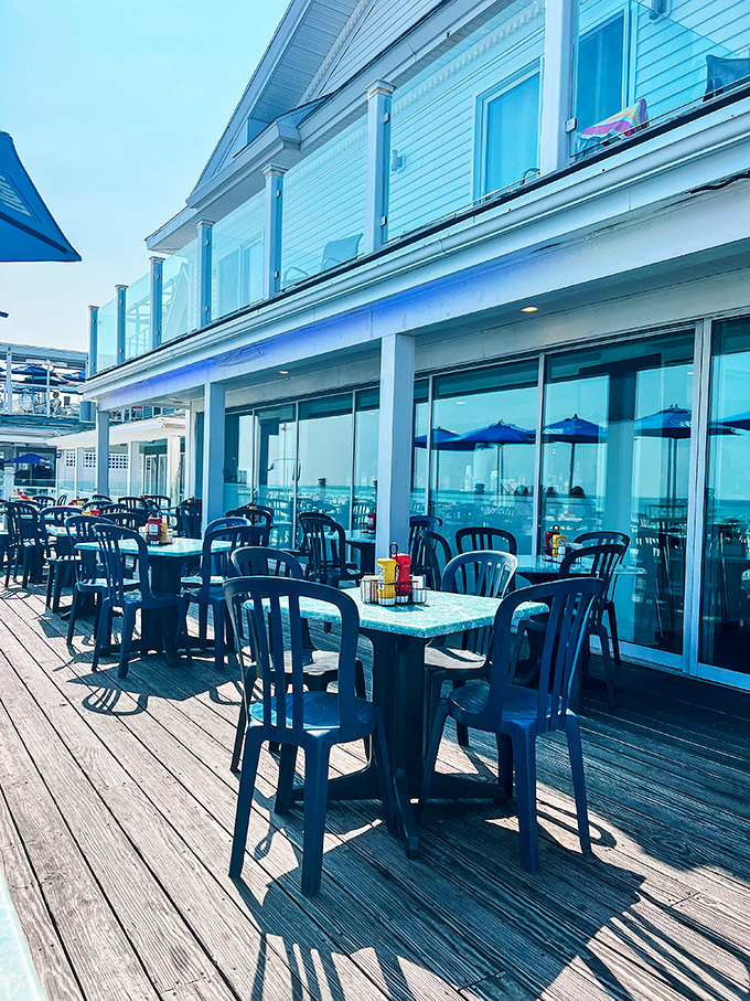 Outdoor dining with ocean views that make everything taste better. These blue chairs have witnessed more "food epiphanies" than a cooking show.
