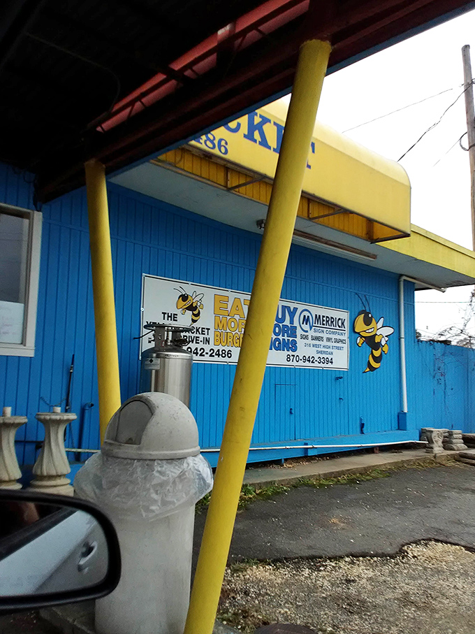 Yellow poles and blue walls frame this roadside classic where generations of Arkansans have created delicious memories one burger at a time.