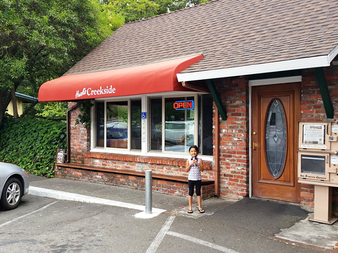 The red awning pops against the brick exterior &ndash; a cardinal among sparrows, announcing "good food lives here" without saying a word.