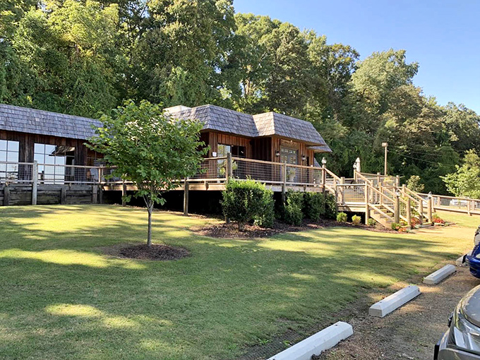 Perfectly manicured grounds surround this riverside retreat, where the journey to great catfish begins with a stroll across the wooden deck.