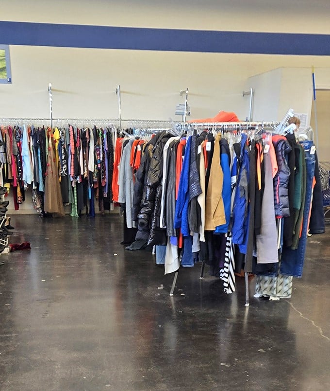 The clothing racks stand like soldiers, each hanger a potential wardrobe revolution waiting to be discovered by savvy shoppers.