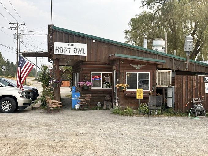 The American flag flutters beside the rustic wooden exterior, flower baskets adding touches of color&mdash;a quintessential small-town Idaho breakfast spot that delivers big flavors.