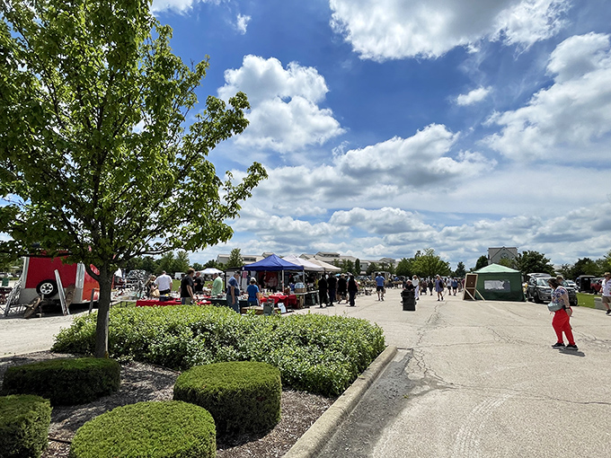 Summer treasure hunting: Perfectly manicured grounds frame the outdoor section where early birds catch the best finds before the Illinois sun climbs too high.