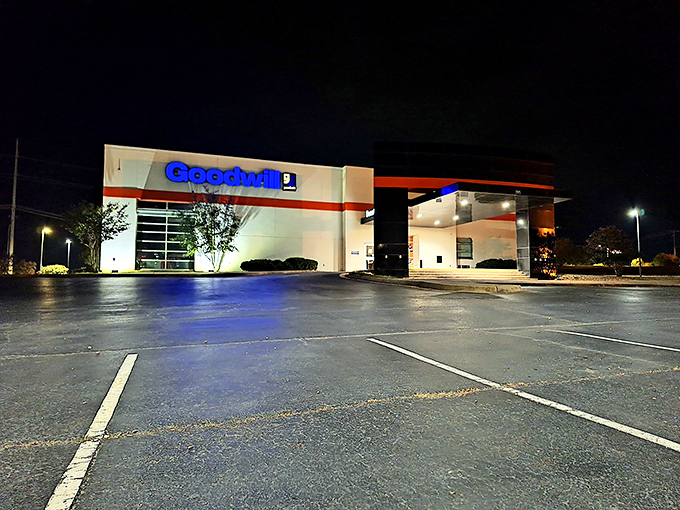 Even at night, the Goodwill's welcoming glow beckons bargain hunters. Tomorrow's adventures in thrifting begin with yesterday's donations.