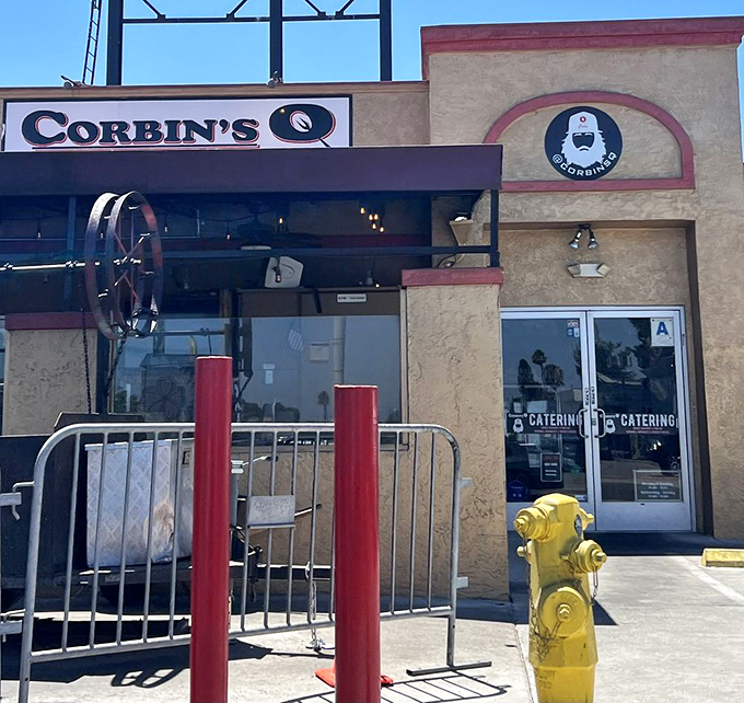 The corner location on Rolando Boulevard where neighborhood charm meets seriously impressive barbecue skills and cold brews.