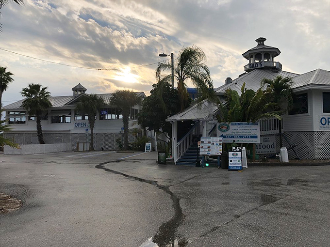 As the sun sets behind Billy's Stone Crab, the white buildings glow with promise of memorable meals to come.