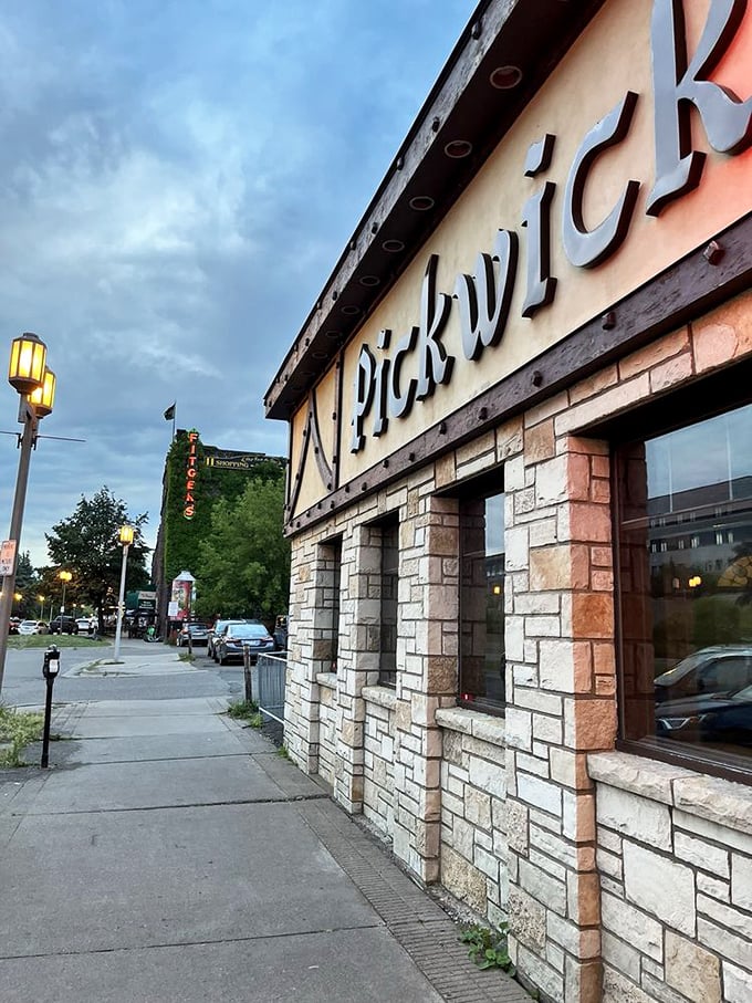 As dusk falls, the Pickwick's exterior lighting creates a warm glow that beckons passersby like a lighthouse for the hungry. Duluth's dining landmark stands ready for another evening of memory-making.