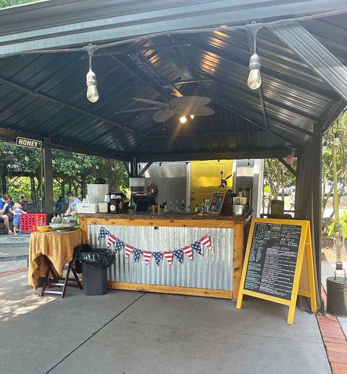 The outdoor bar brings honeycomb motifs and sunny yellow accents together, proving that even the drink service stays faithfully on-theme at this bee-loved spot.