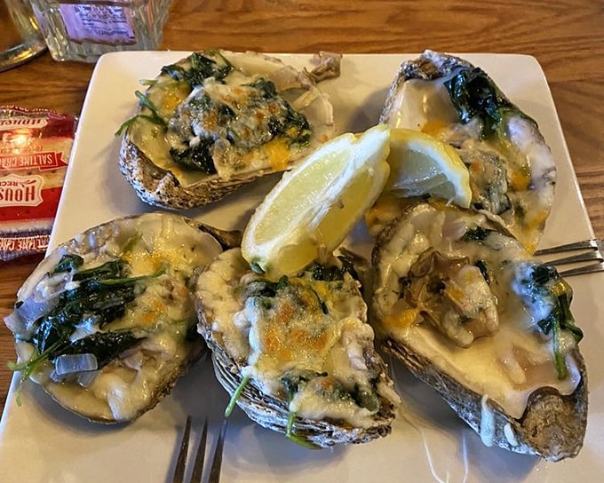 Oysters Rockefeller dressed to impress—like tiny ocean treasures wearing their finest spinach and cheese formal wear for your dining pleasure.