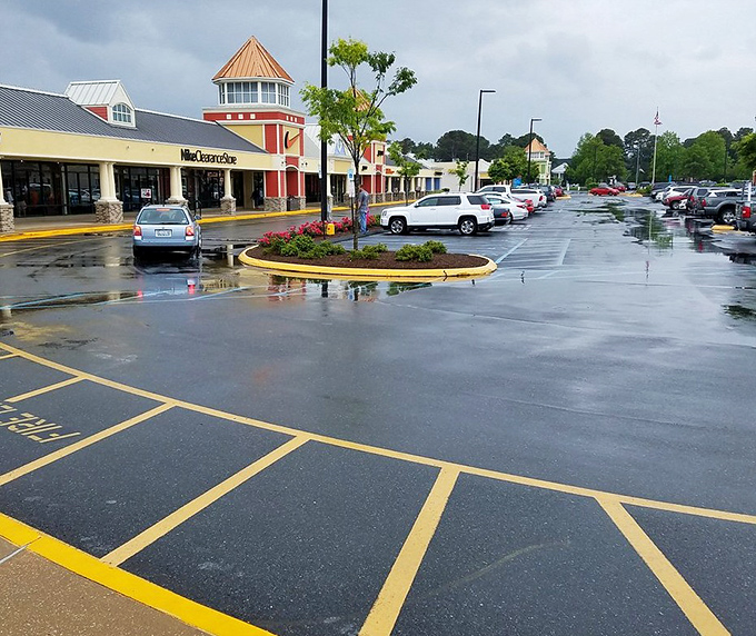 Even on rainy days, the parking lot fills with vehicles of determined shoppers who know that precipitation just means fewer crowds and more elbow room at the clearance racks.