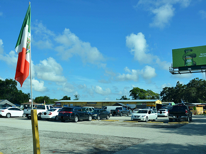 The parking lot&mdash;first challenge in your treasure hunting adventure. Mexican and American flags wave in welcome, promising international flavors inside.