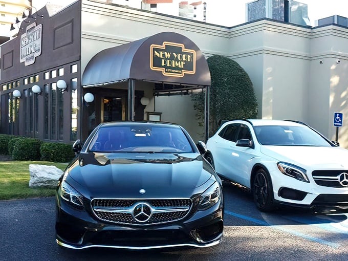 The parking lot reveals the clientele's excellent taste extends beyond just dinner selections. Mercedes: the official vehicle of serious steak enthusiasts.