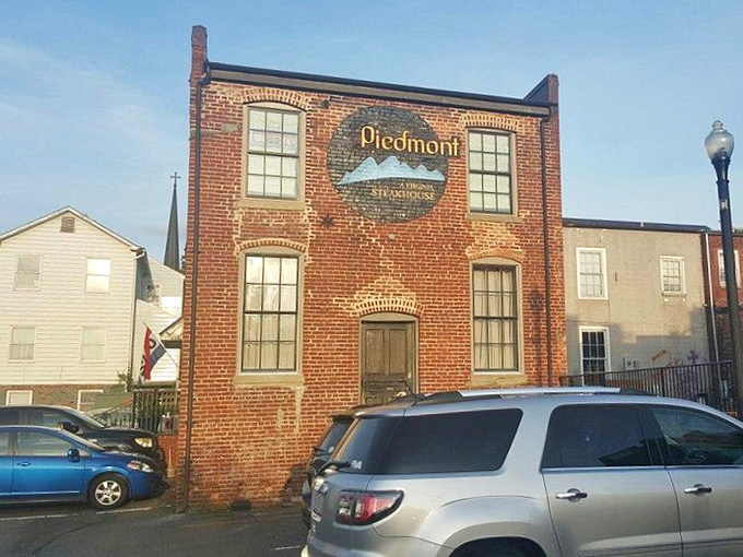 From this angle, Piedmont looks like any other historic building in town—which is exactly how the best culinary secrets stay hidden in plain sight.