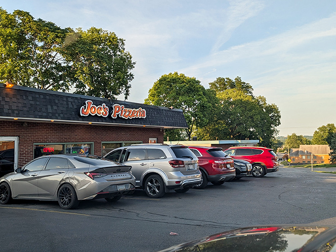 A full parking lot at an unassuming pizza joint tells you everything you need to know&mdash;locals don't keep secrets this delicious.