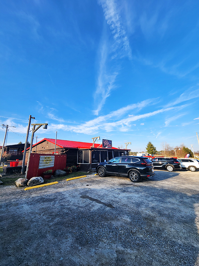Even on a cloudy day, that red roof and rustic exterior promise sunshine for your taste buds. The parking lot is where the anticipation begins.