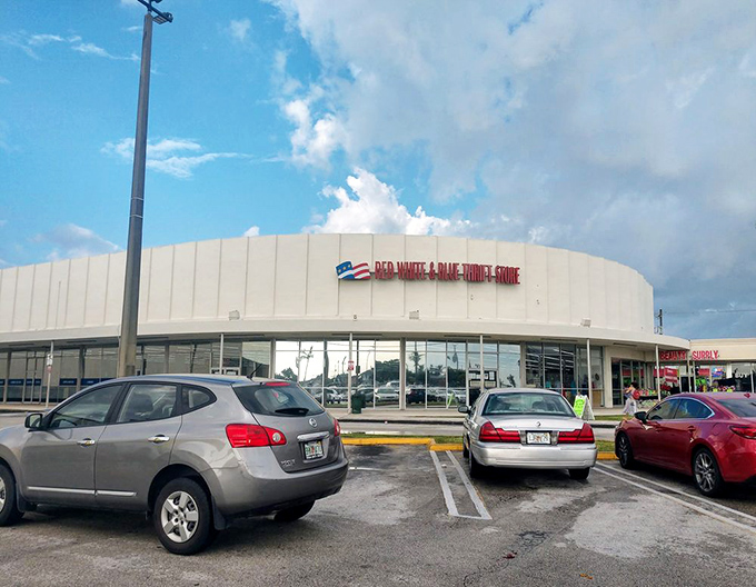 The full name in lights! Red White & Blue Thrift Store announces itself against the Florida sky, a beacon for bargain hunters everywhere.