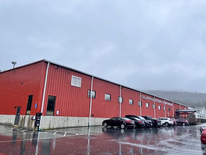 Rain-slicked parking lot outside the unassuming red barn that houses countless treasures. Don't judge this book by its metal cover.