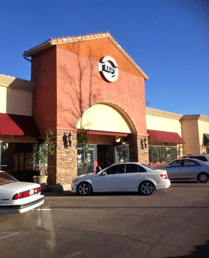 The distinctive orange facade stands out in the parking lot like a barbecue lighthouse, guiding hungry souls to smoky salvation.